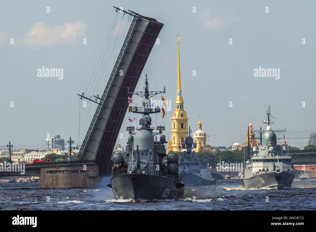 Warships parade on the Neva river past the Liteyny bridge during a Navy ...