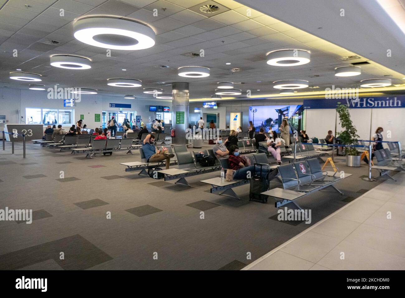 People in the waiting area in front of the gates in Athens Airport ...