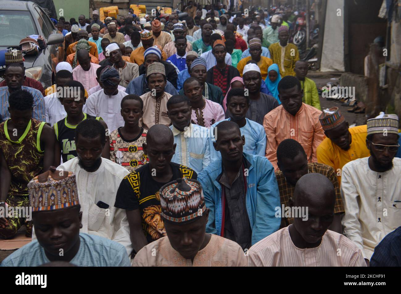 Muslim devotees prayer outside the kara Cattle Market Mosque as they ...