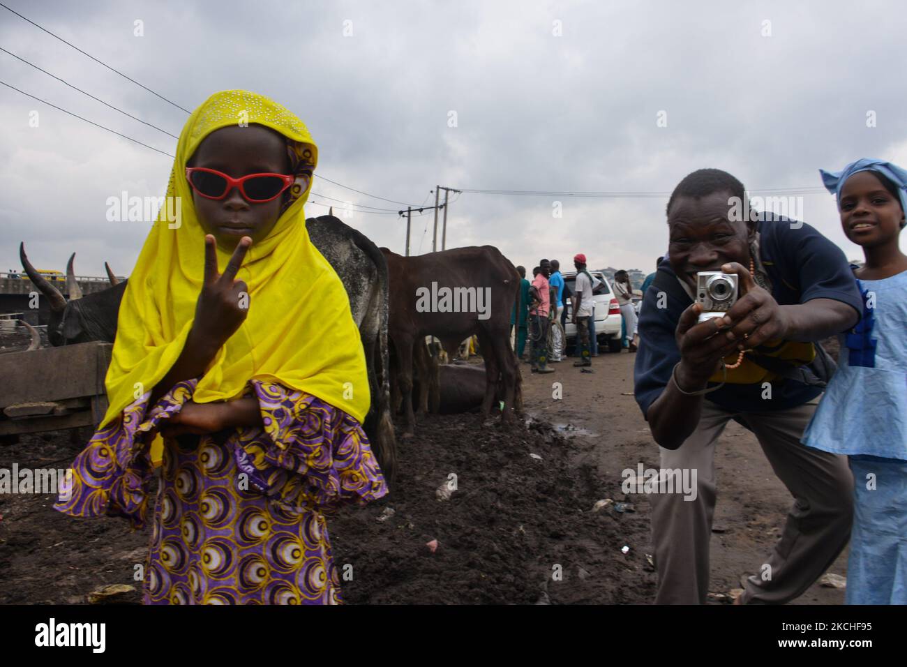Girl pose for portrait after taking part in the Eid al-Adha prayer at ...