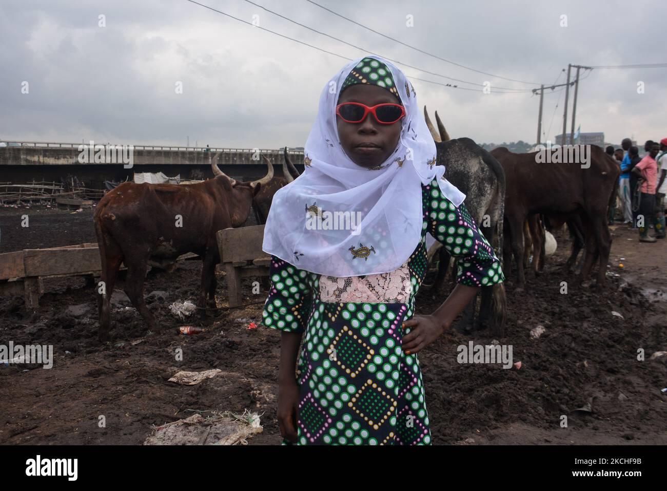 Girl pose for portrait after taking part in the Eid al-Adha prayer at ...