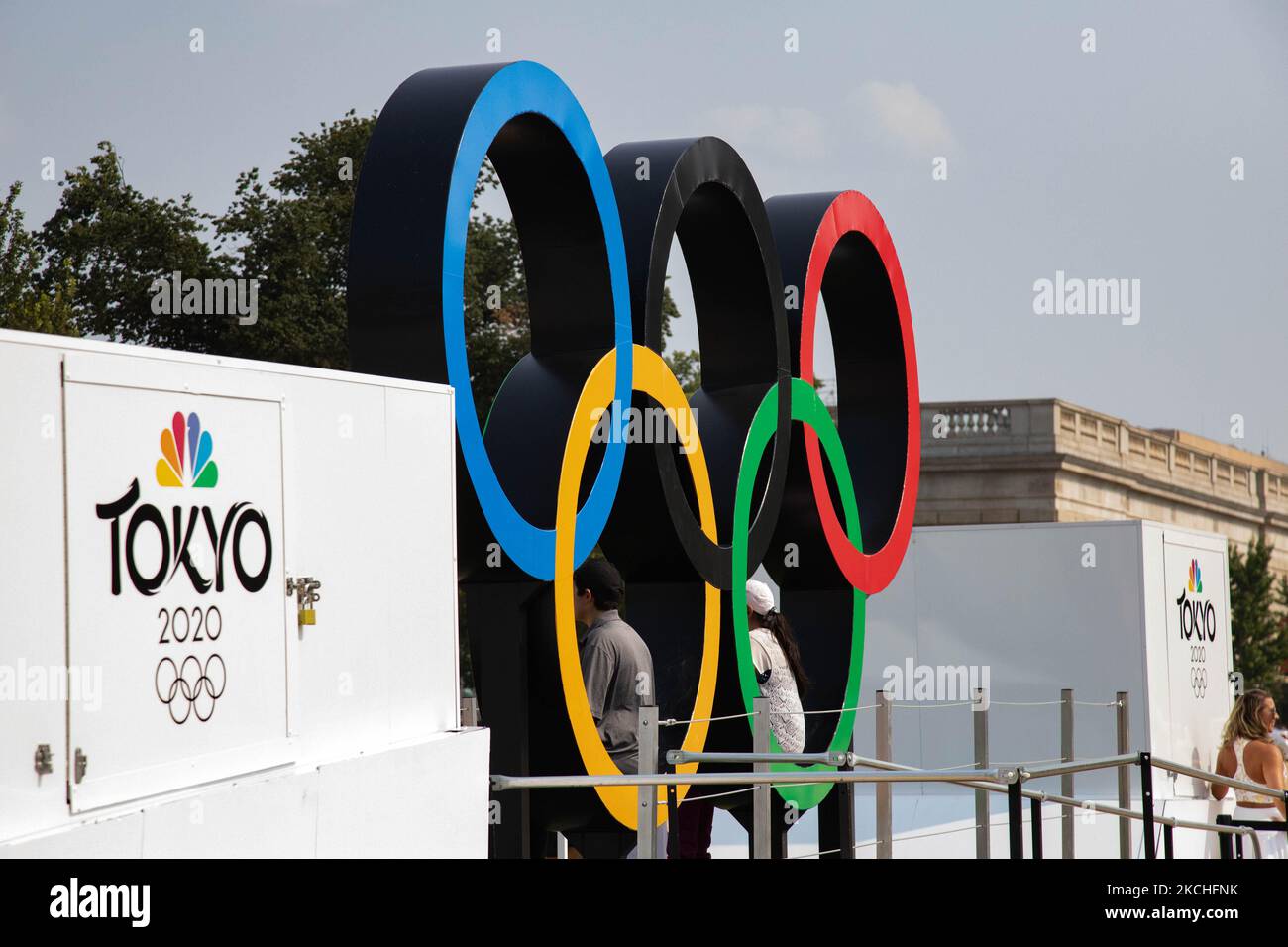 People pose at the 'Rings Across America' exhibit by NBC Universal on ...