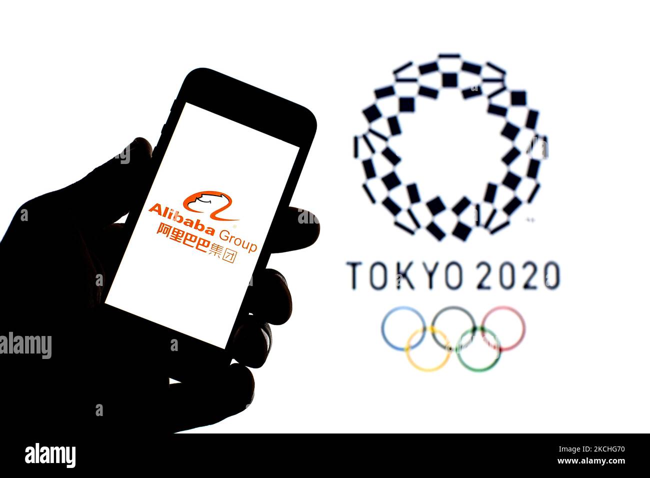 In this photo illustration a Alibaba Group logo seen displayed on a ...