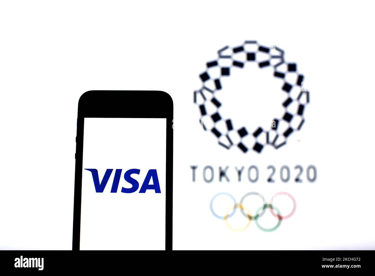 In this photo illustration a Visa Inc. logo seen displayed on a ...