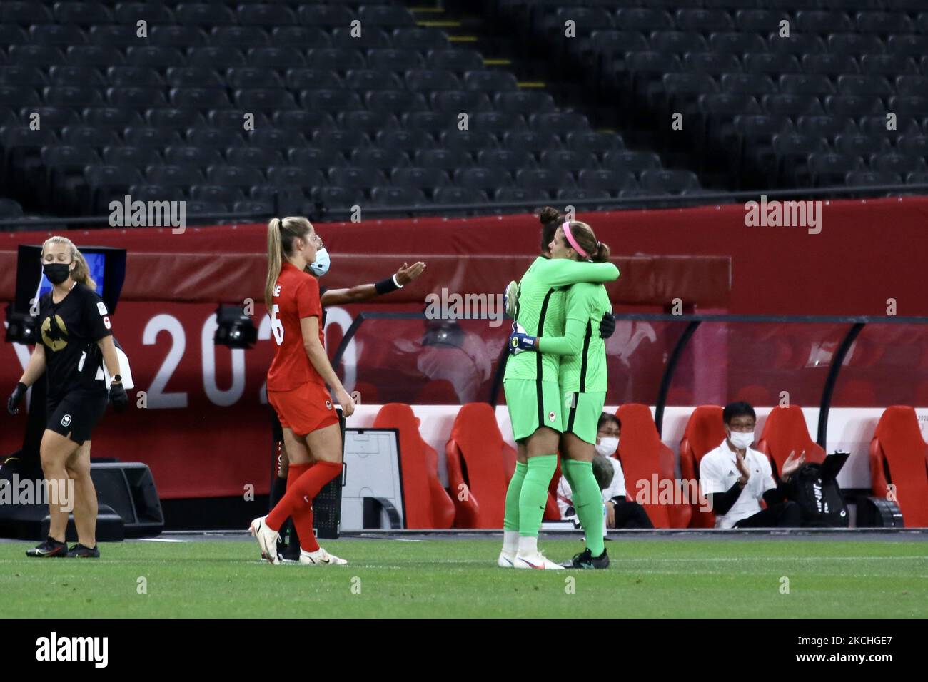 (1) Stephanie Labbe of Team Canada is embraced by teammate (18) Kailen ...