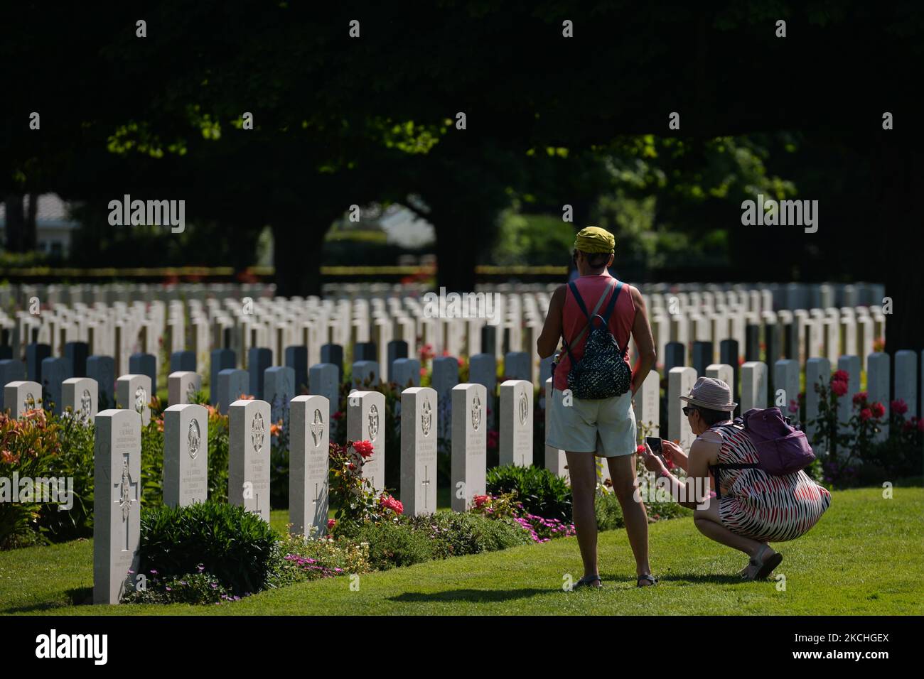 Visitors seen inside the Bayeux War Cemetery with British and ...