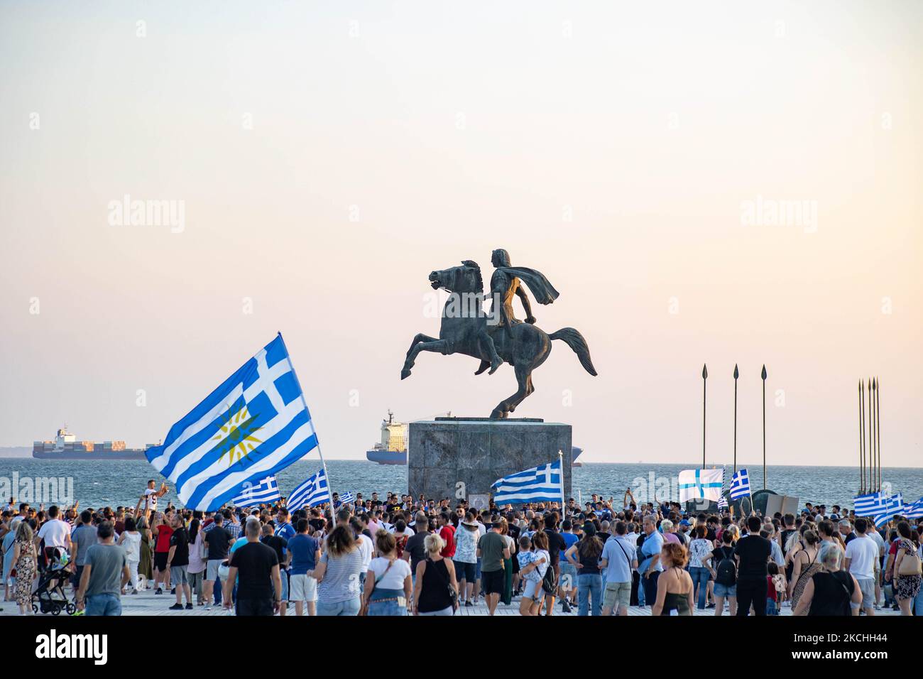 The statue of Alexander the Great and Greek flags at the end of the ...