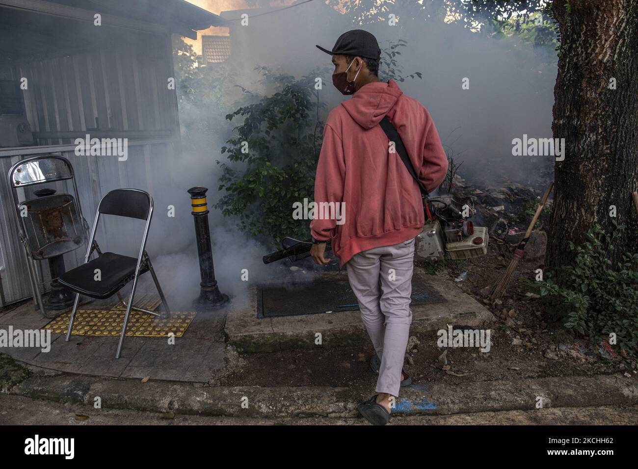 An officer conducts fogging in the BSD area, South Tangerang, Banten ...