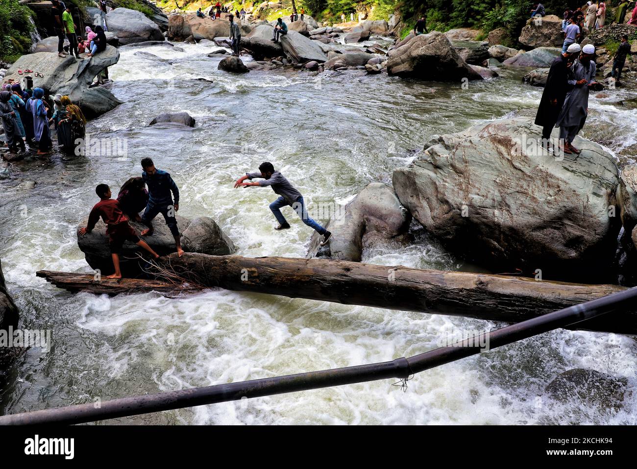 Local Tourists enjoy at Shrunz Waterfall on a hot day in Baramulla ...