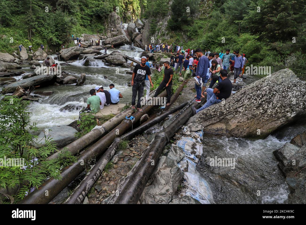 Local Tourists enjoy at Shrunz Waterfall on a hot day in Baramulla ...