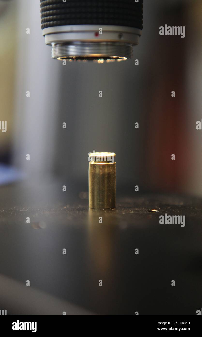 Bullet under a microscope at a college program teaching Crime Scene ...