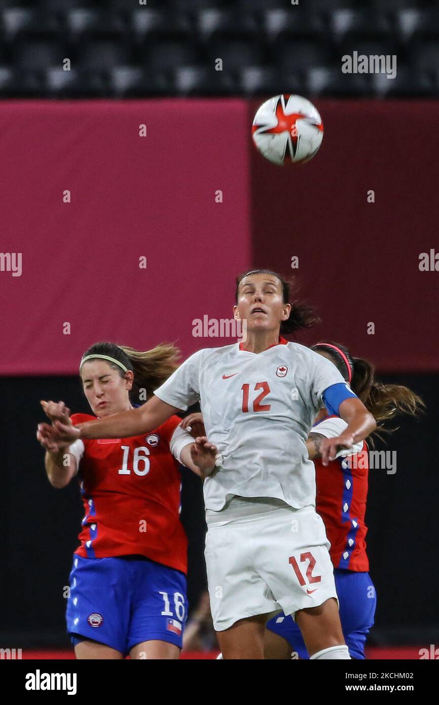 (12) Christine SINCLAIR of Team Canada battles for possession with (15 ...