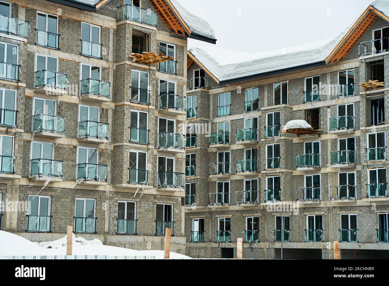 Construction of a hotel building in a ski resort Stock Photo - Alamy