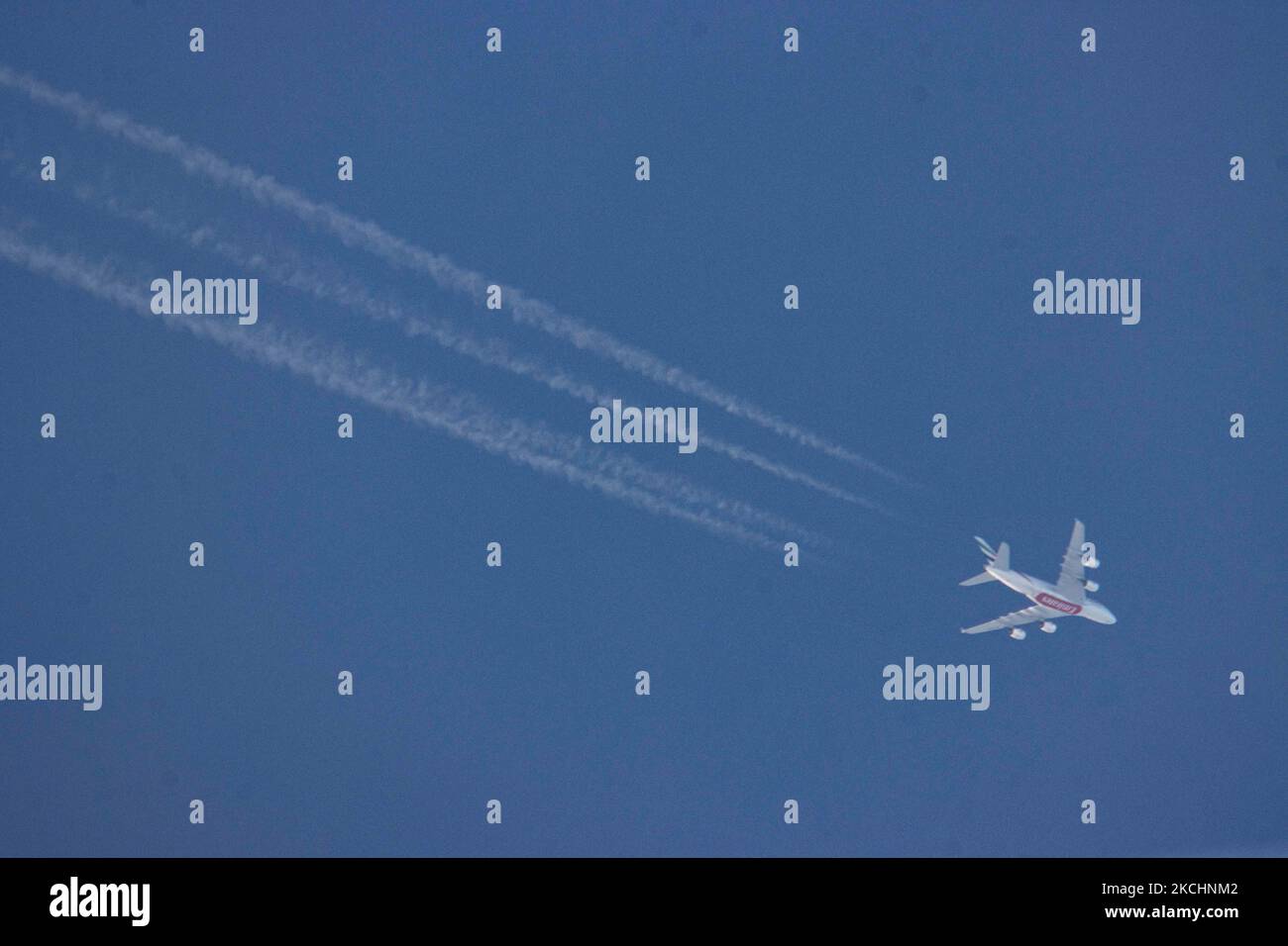 Emirates Airbus A380 aircraft as seen flying in the blue summer sky ...