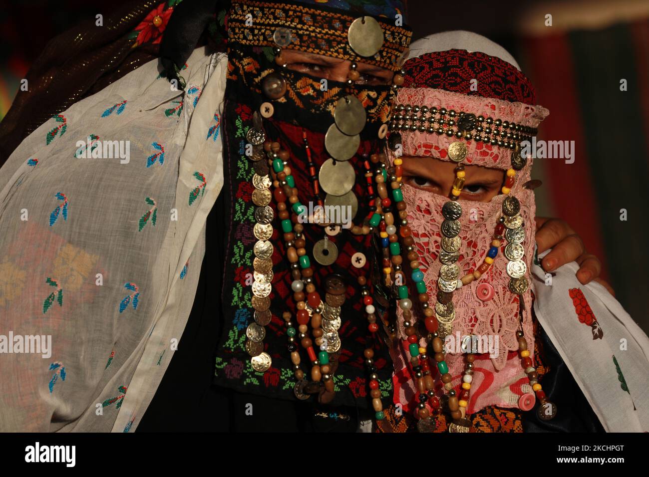 Palestinians participate in an event to mark the Palestinian ...