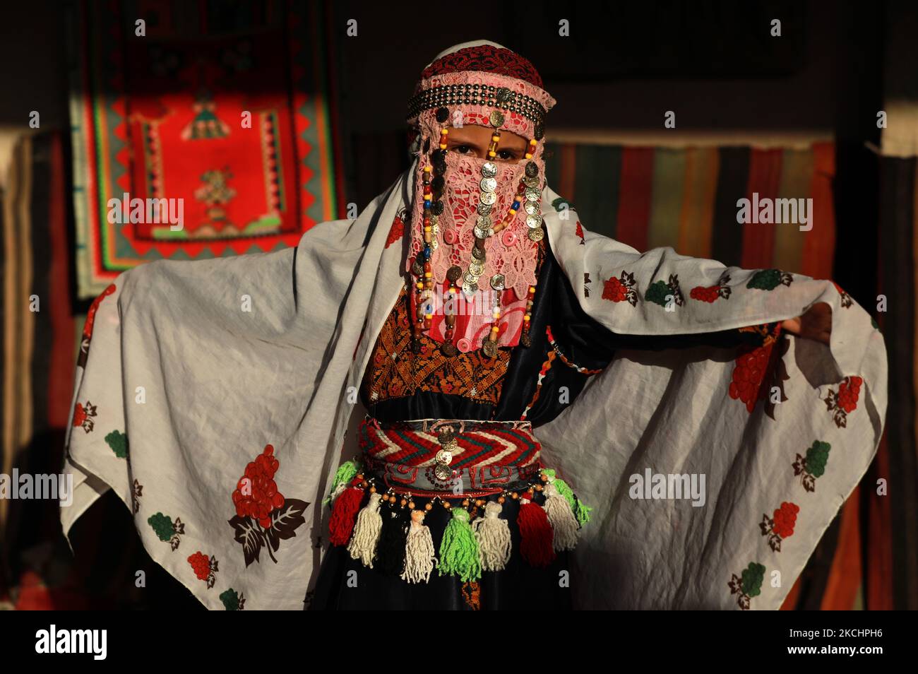 A girl participates in an event to mark the Palestinian Traditional ...