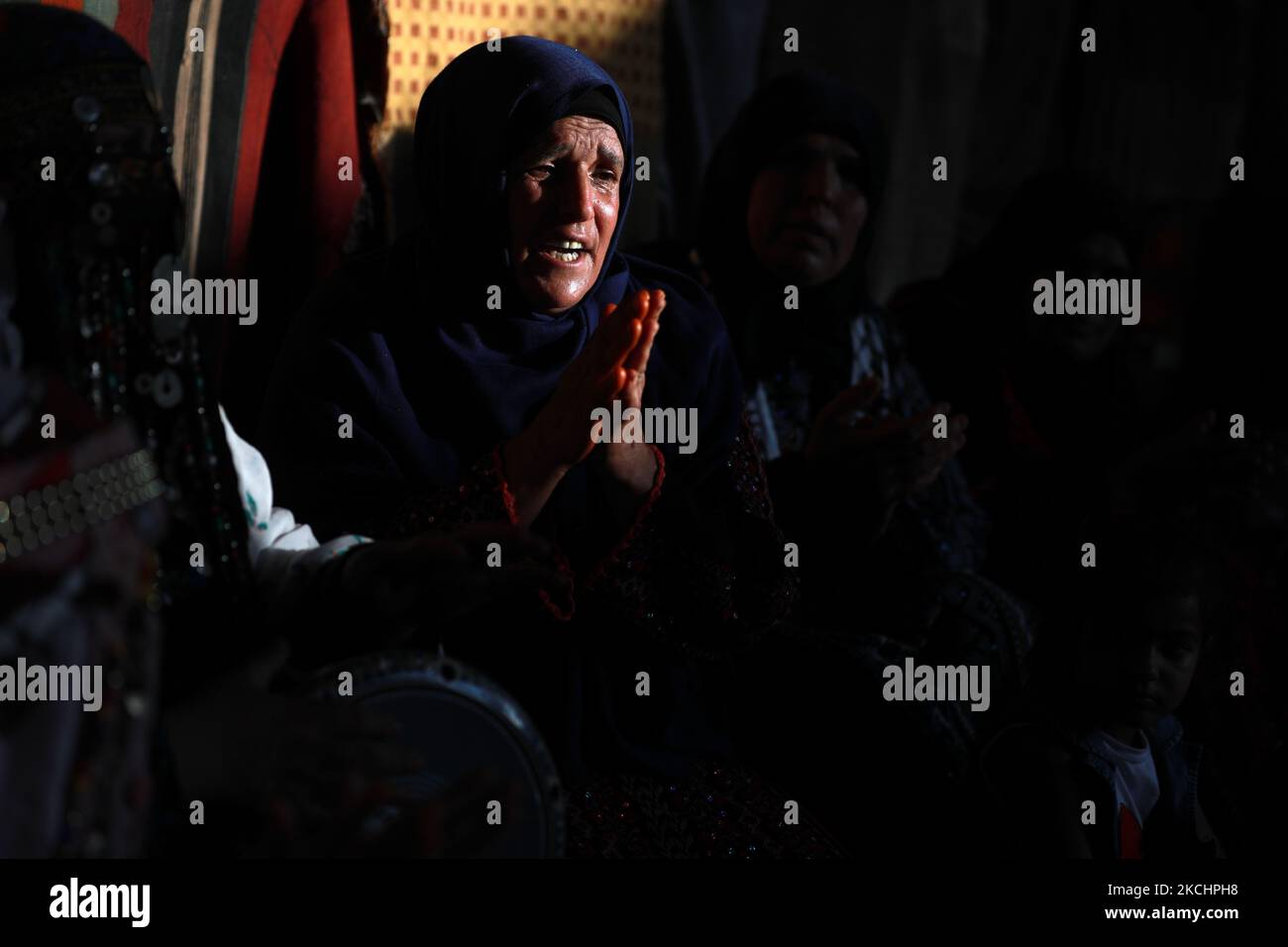 Palestinians participate in an event to mark the Palestinian ...