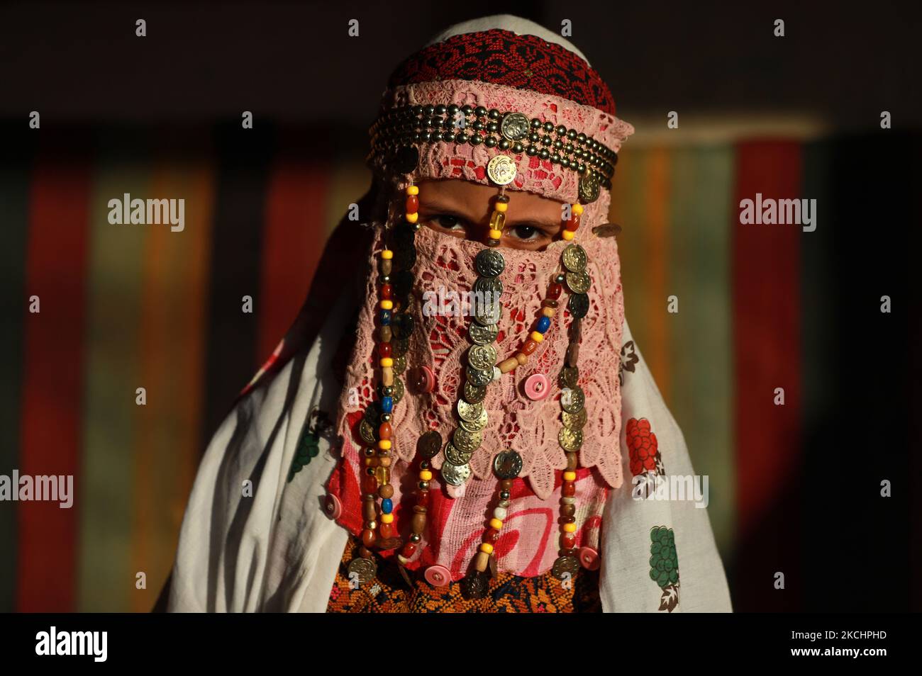 A girl participates in an event to mark the Palestinian Traditional ...
