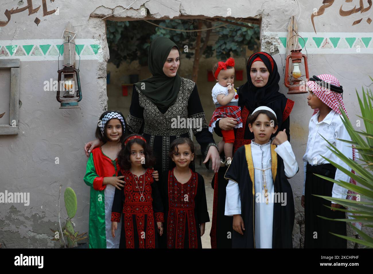 Palestinians participate in an event to mark the Palestinian ...