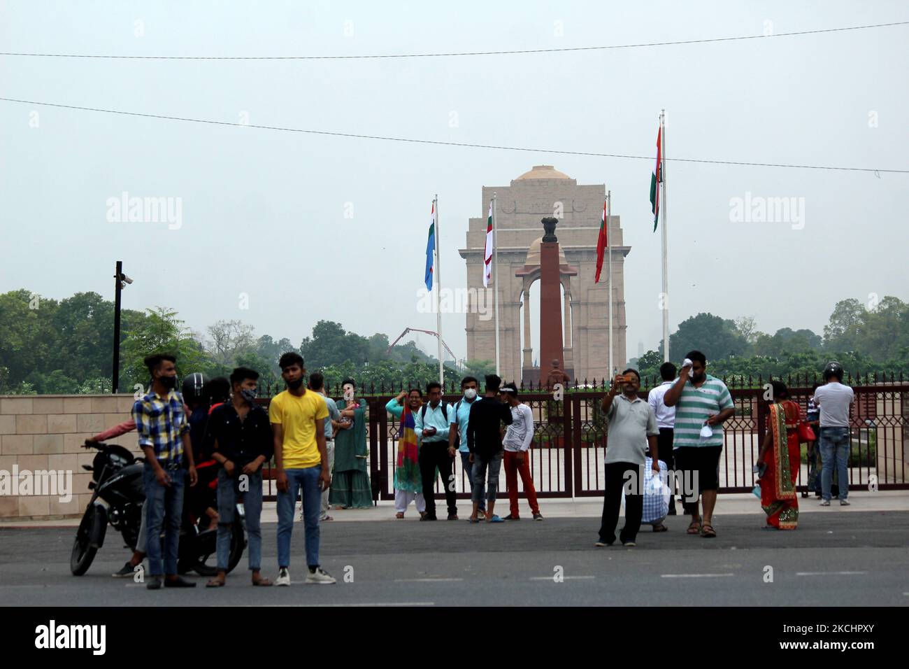 People click pictures at the India Gate War memorial, as they gather to ...