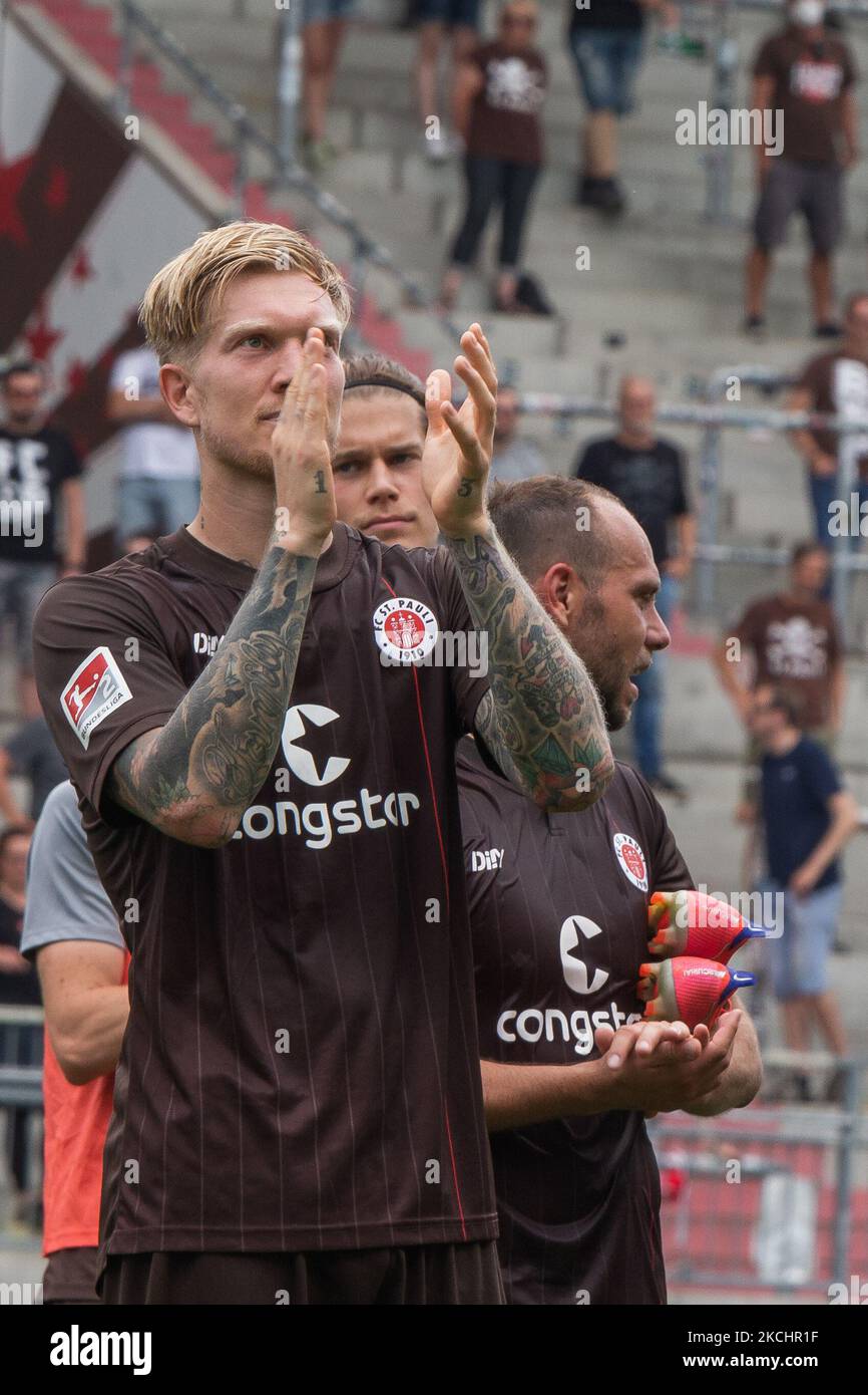 Simon Makienok of FC St. Pauli celebrate with fans following their ...