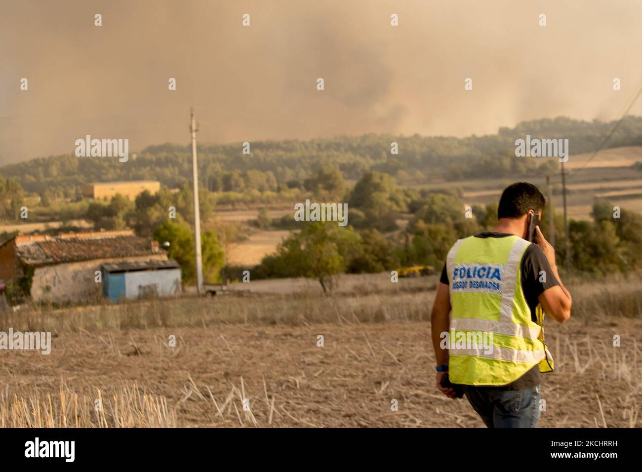 Firefighters and volunteers are working to stop the wildfire in the ...
