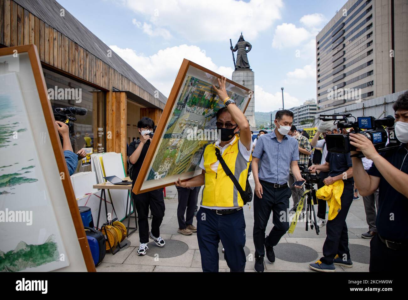 Members of the Sewol victims' council move some Sewol ferry art works ...