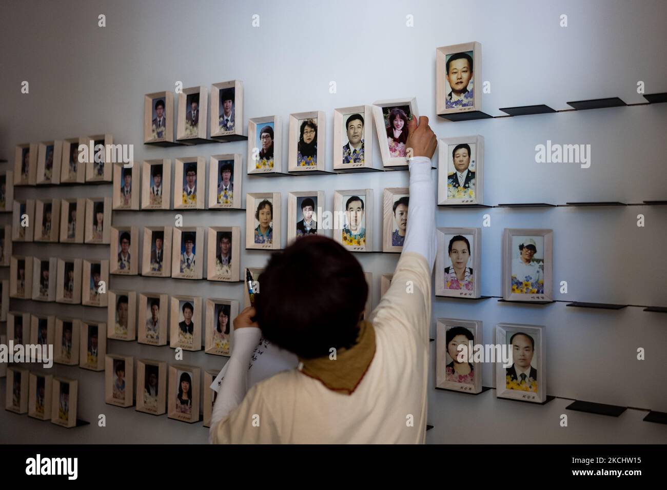 Members of the Sewol victims' council pack portraits of victims which ...