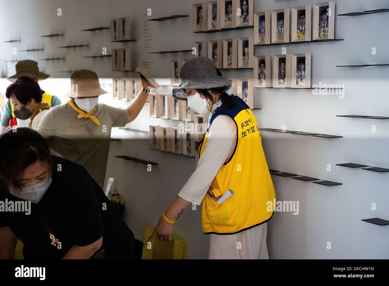 Members of the Sewol victims' council pack portraits of victims which ...