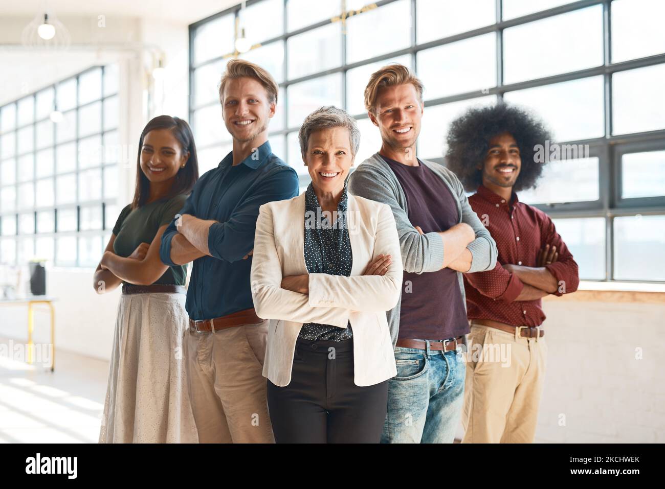 Passion is our secret ingredient. Portrait of a team of happy designers ...