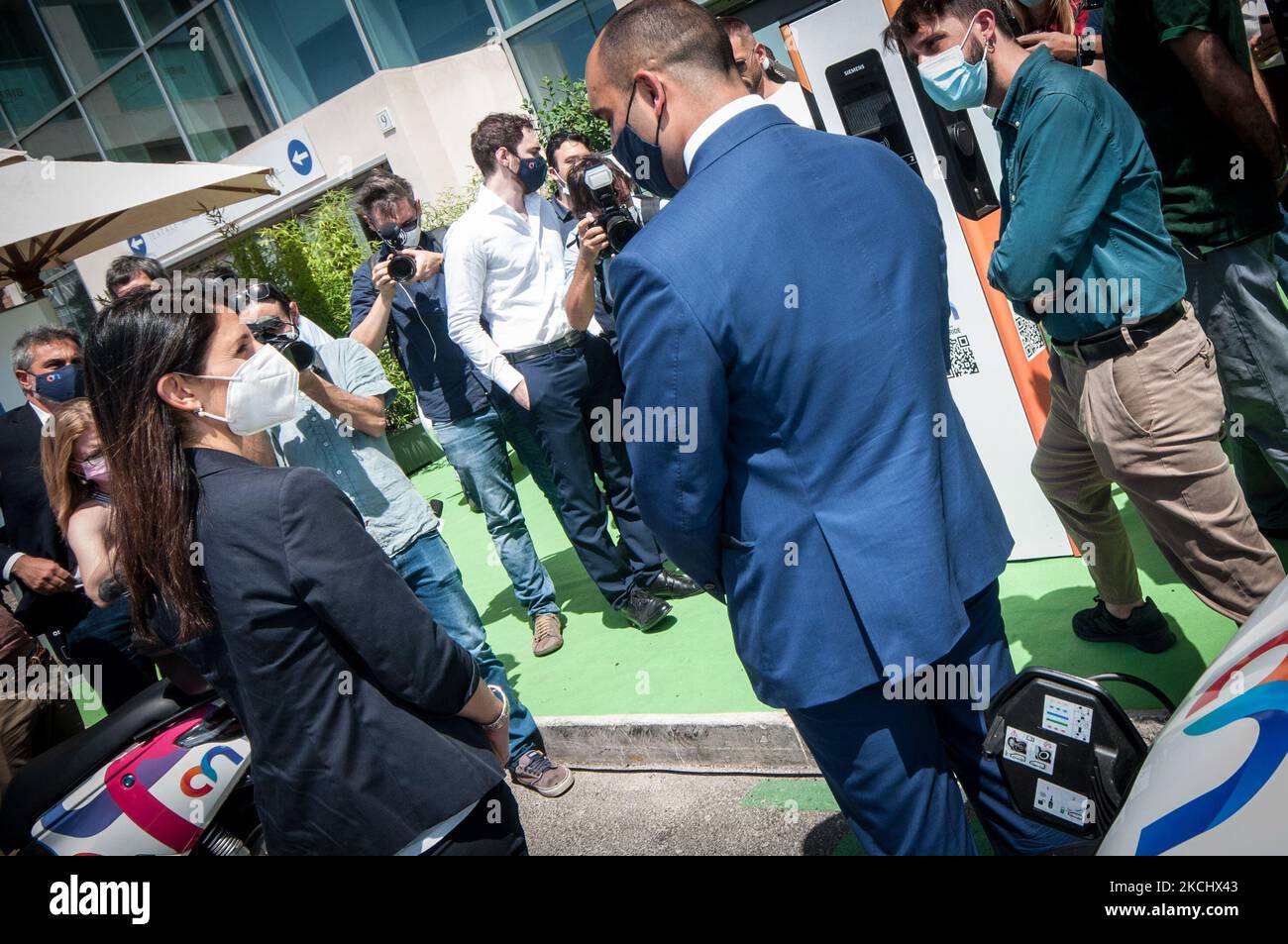 Rome's mayor Virginia Raggi (L) and managing director of On Group ...