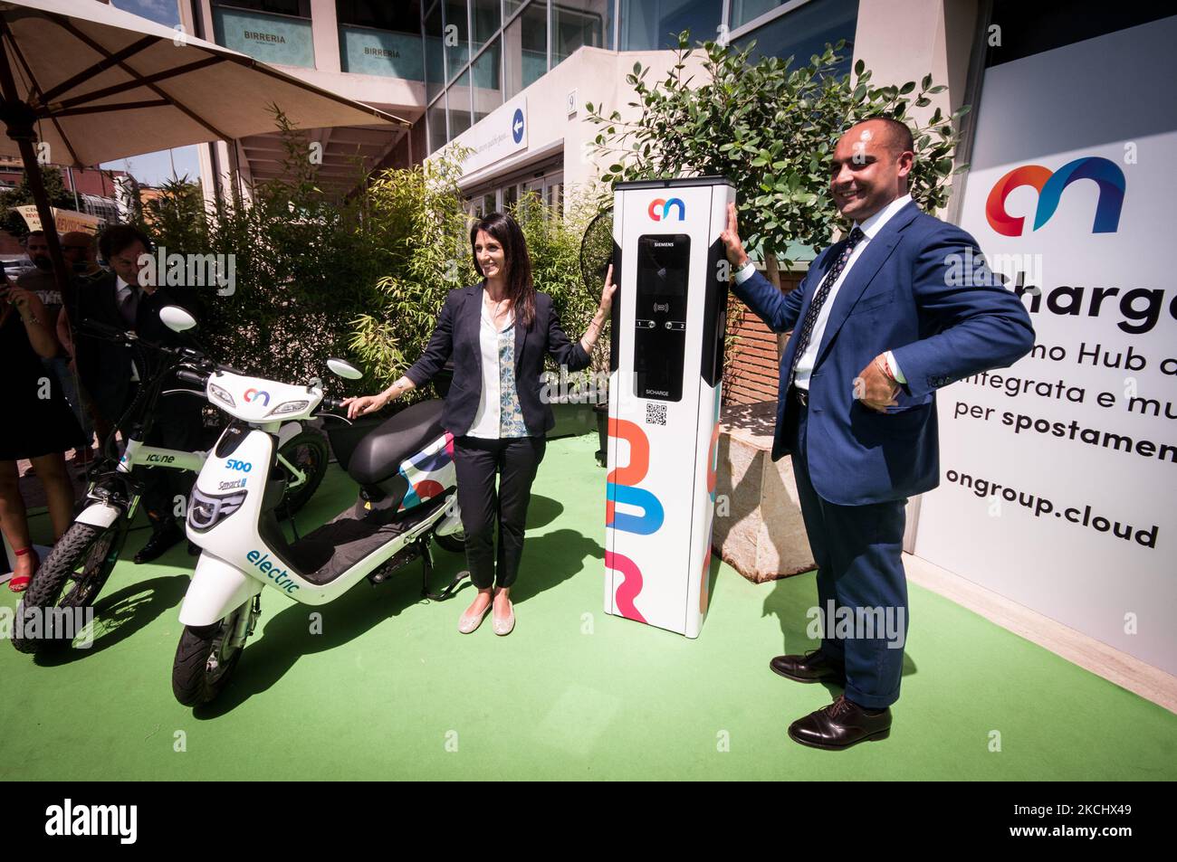 Rome's mayor Virginia Raggi (L) and managing director of On Group ...