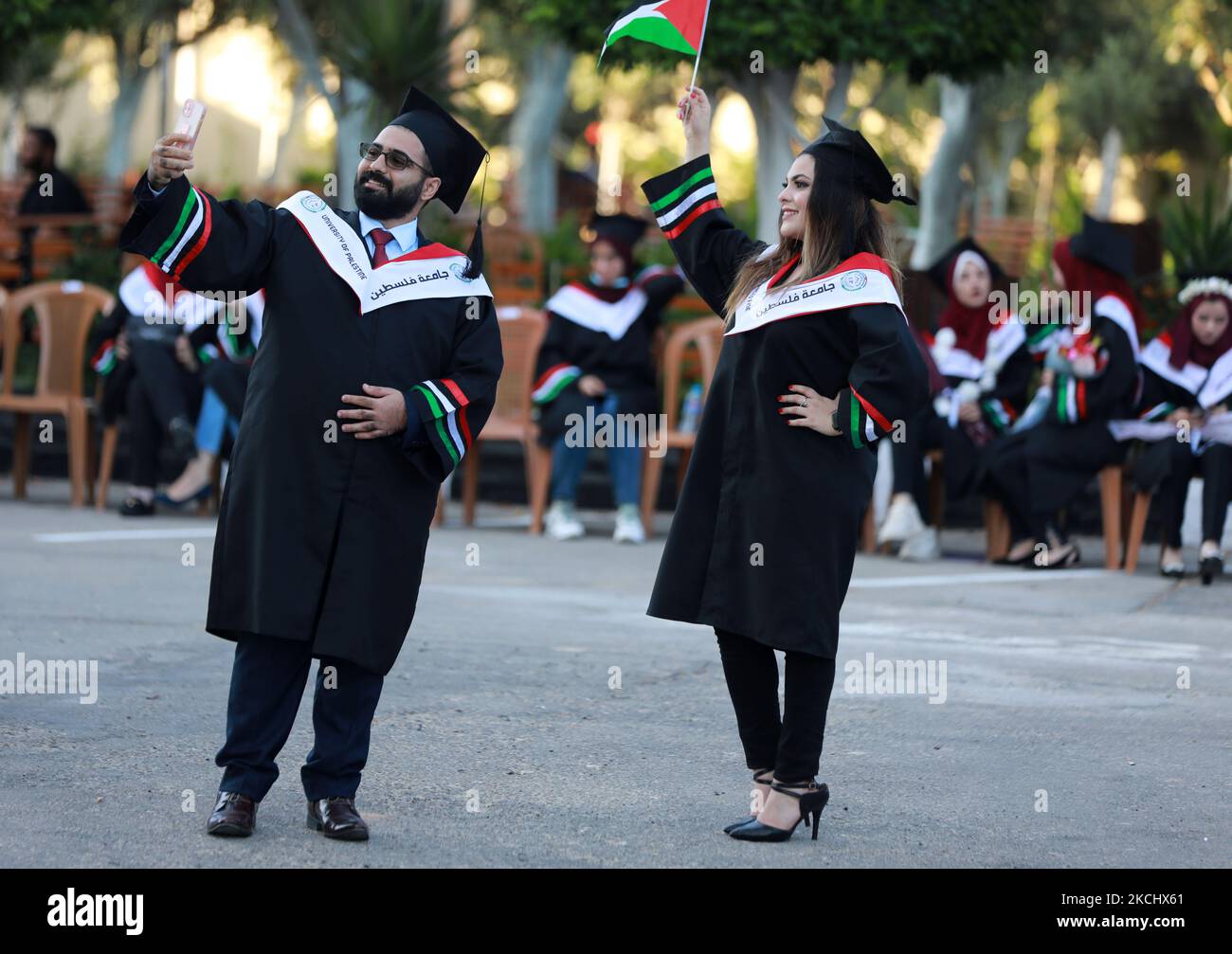 Palestinian female students attend their graduation ceremony at ...