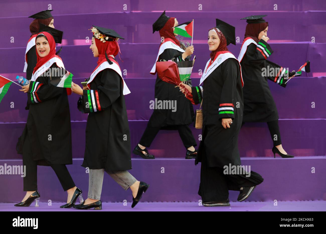 Palestinian female students attend their graduation ceremony at ...