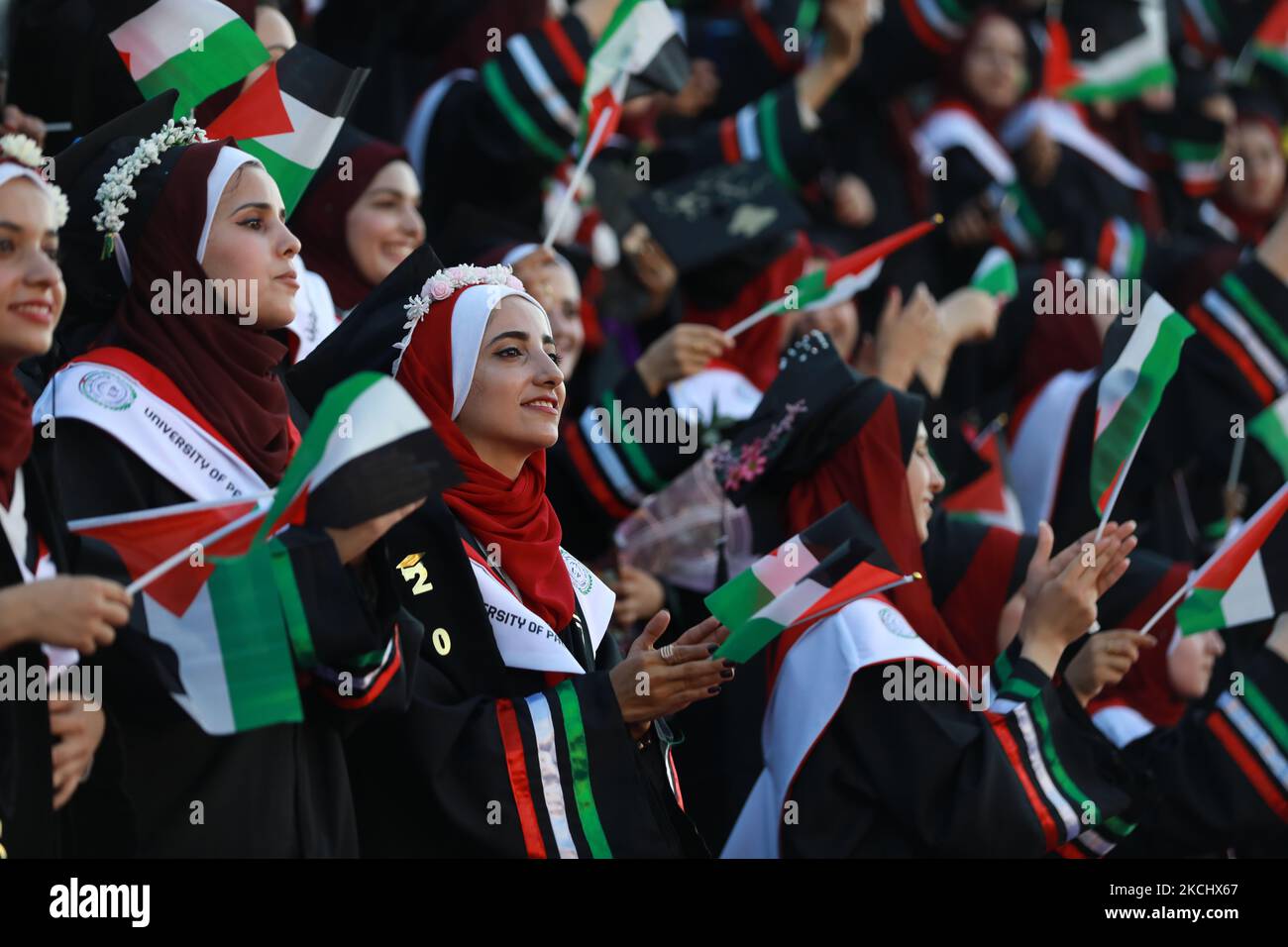 Palestinian female students attend their graduation ceremony at ...