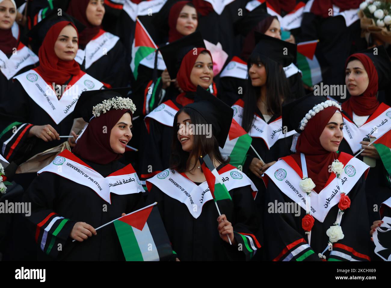 Palestinian female students attend their graduation ceremony at ...