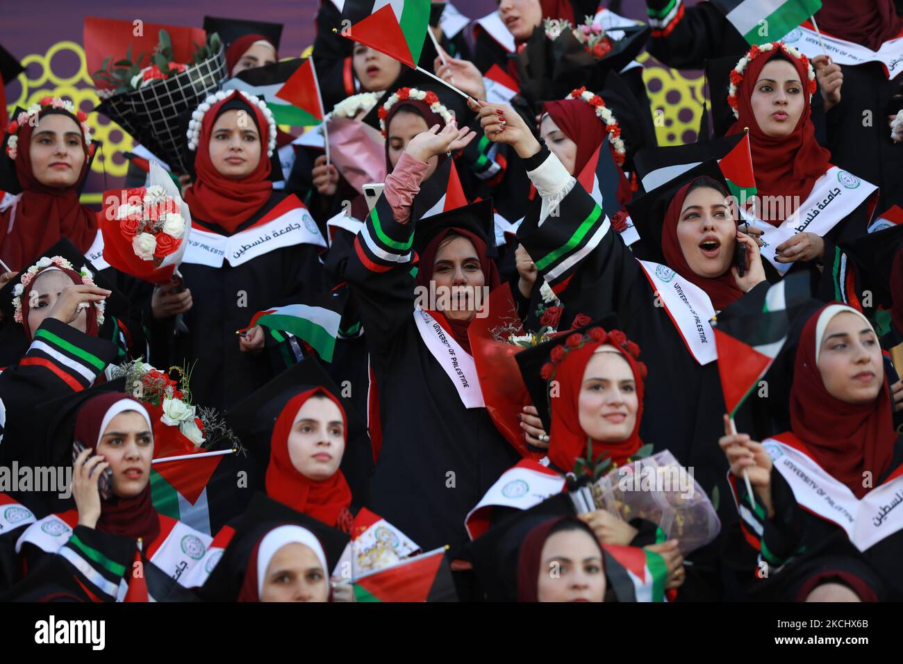 Palestinian female students attend their graduation ceremony at ...