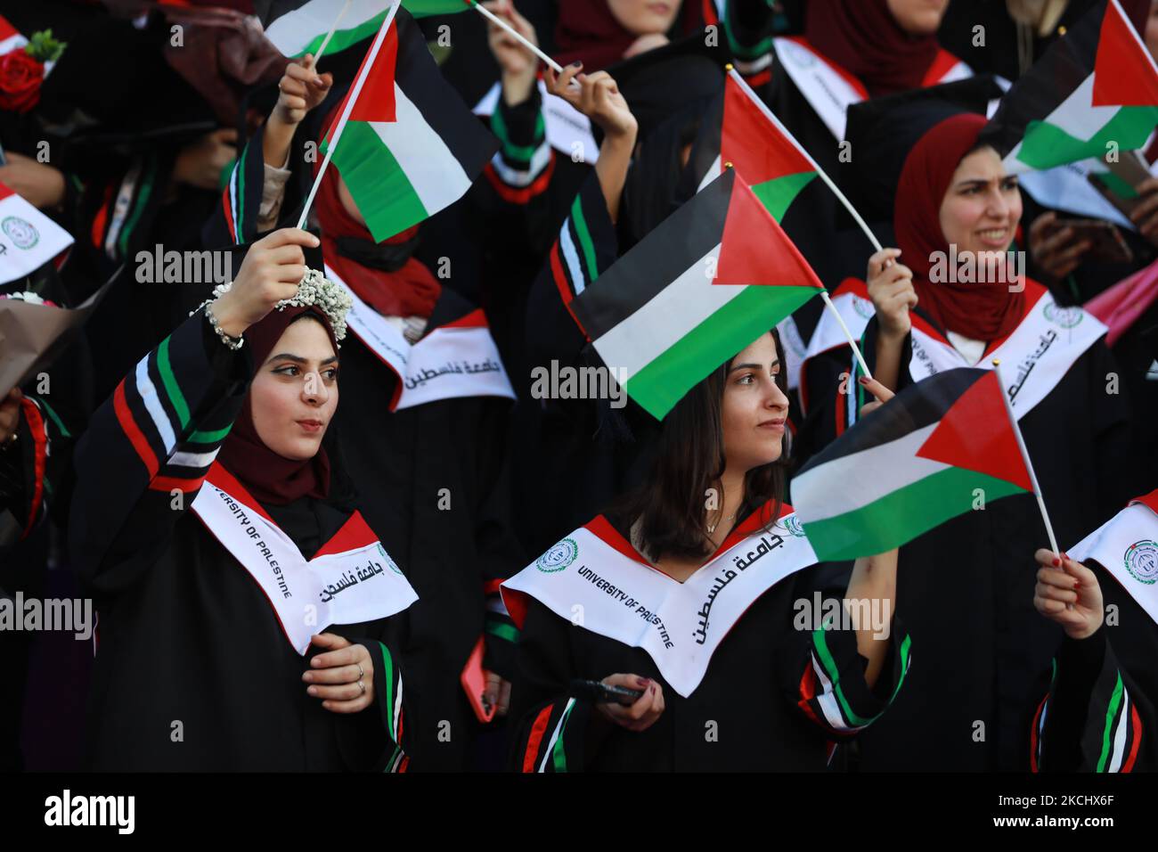 Palestinian female students attend their graduation ceremony at ...