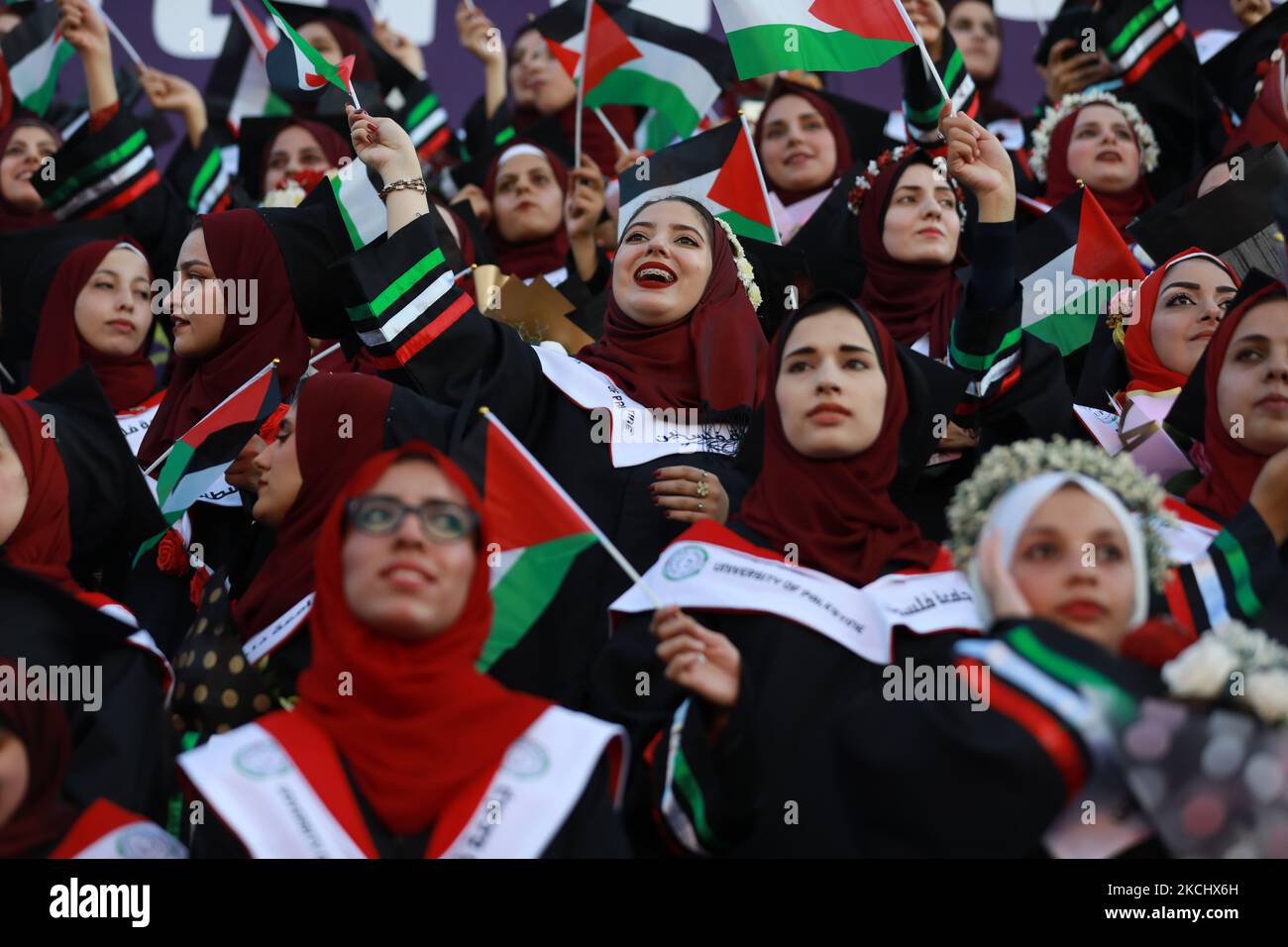 Palestinian female students attend their graduation ceremony at ...