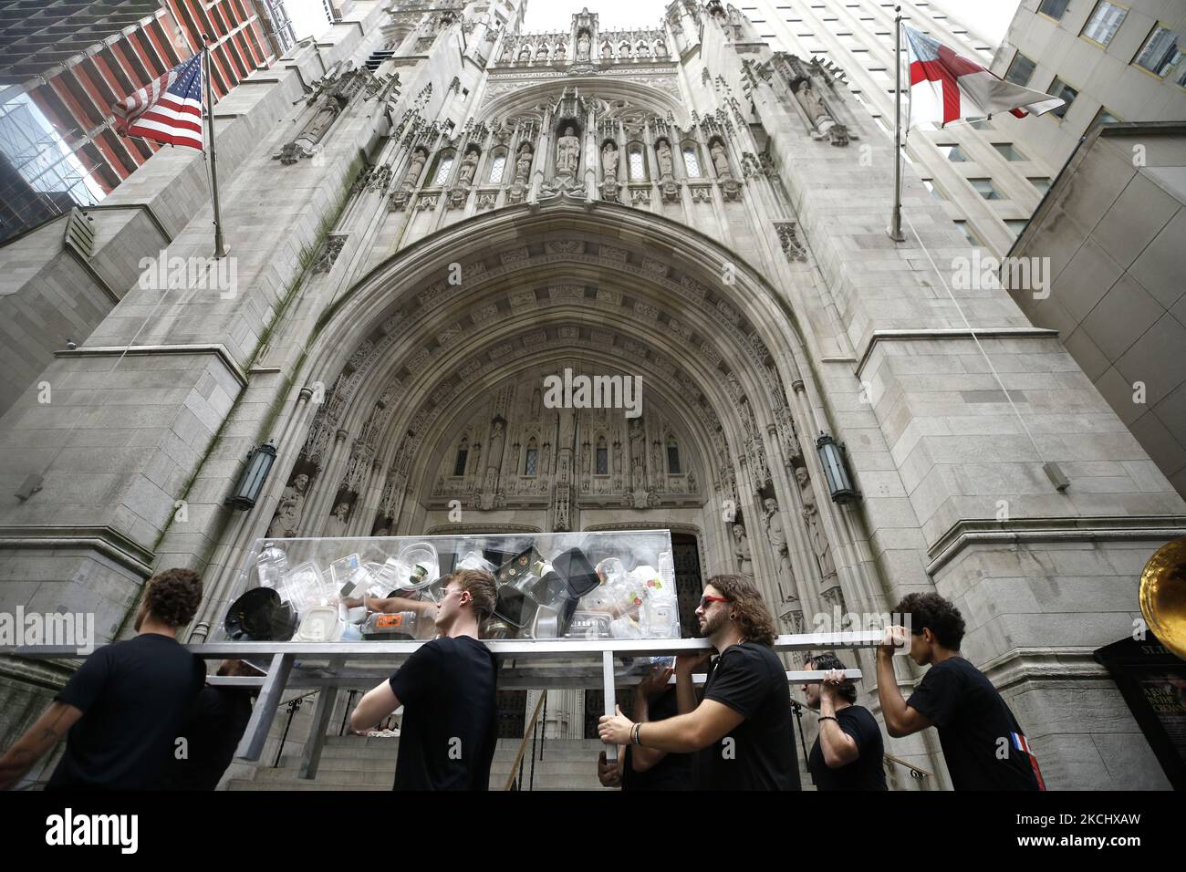 Artist Anne-Katrin Spiess is carried on 5th Avenue in a clear plastic ...