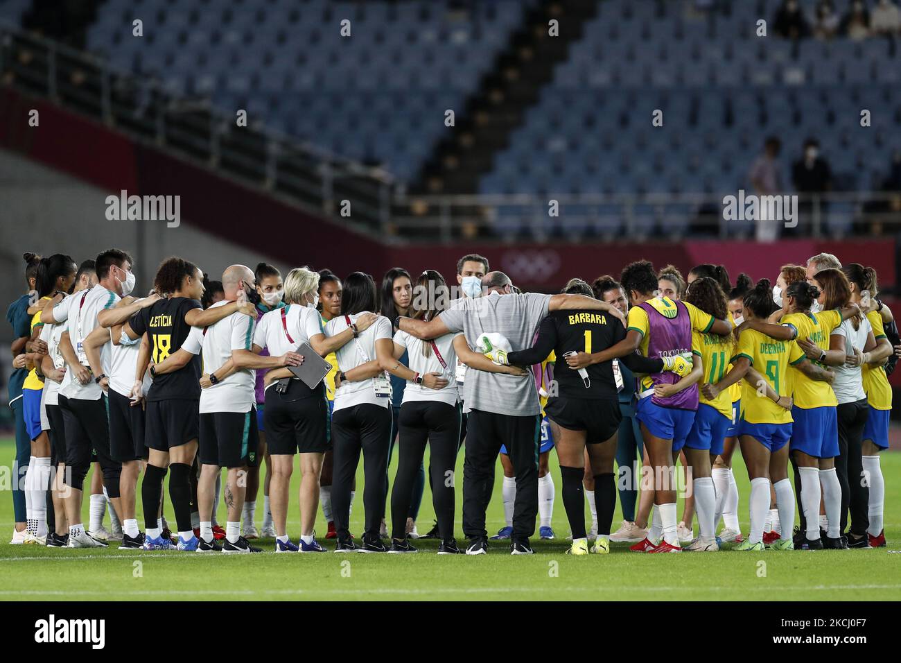 Players of Team Brazil form a huddle following defeat in the Women's ...