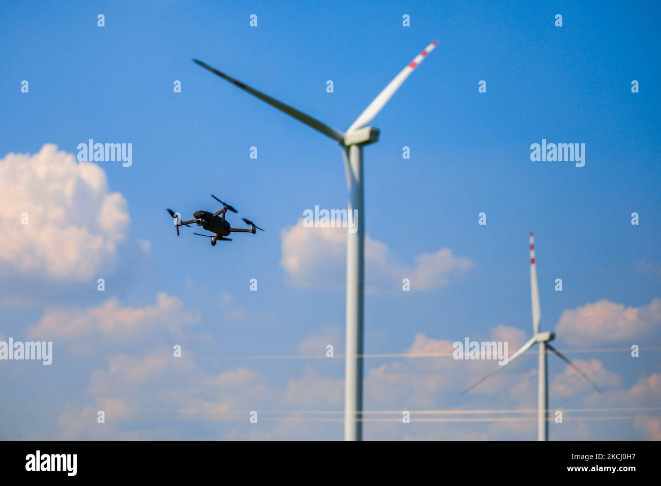 A drone is flying close to wind turbines in Gac village near Lancut ...