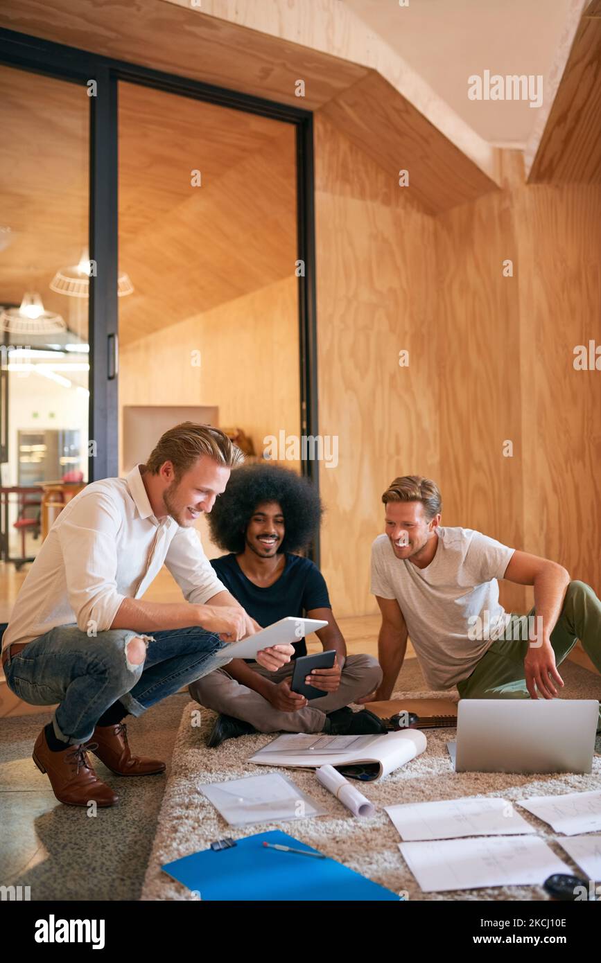 Working hard to keep up with ever-changing trends. a team of designers ...