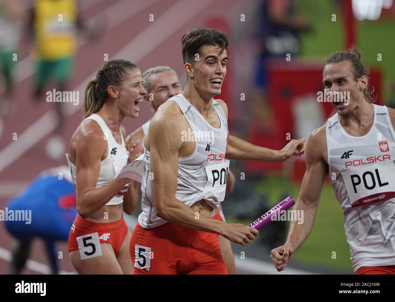 Polish team winning the 4 times 400 meter mixed relay at the Tokyo ...
