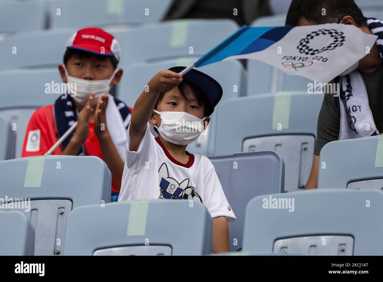 A child waving the flag of the Tokyo Olympics 2020 prior to the Men's ...