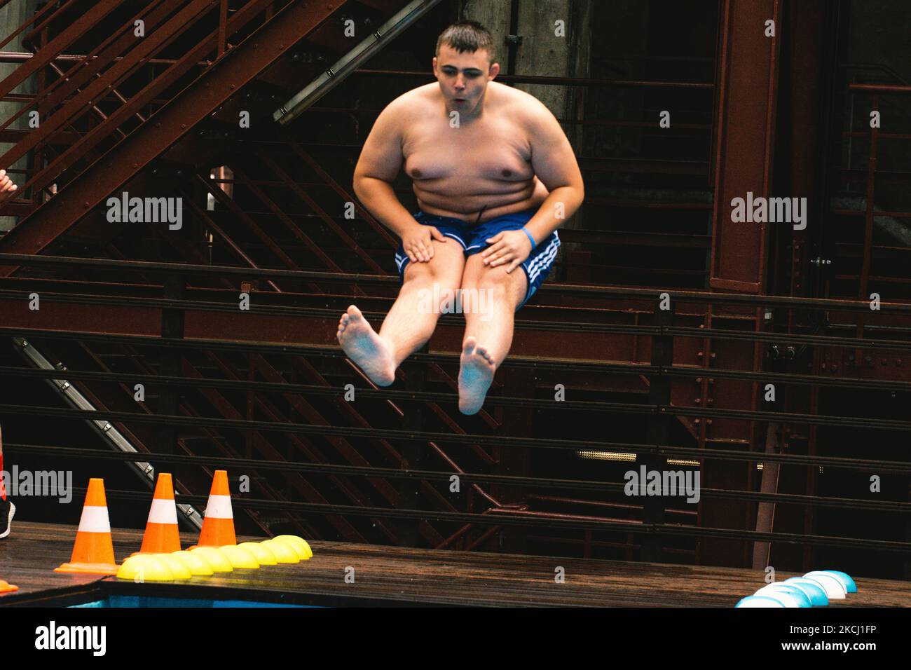 people participate the pool jumping contest at "Werksschwimmbad ...