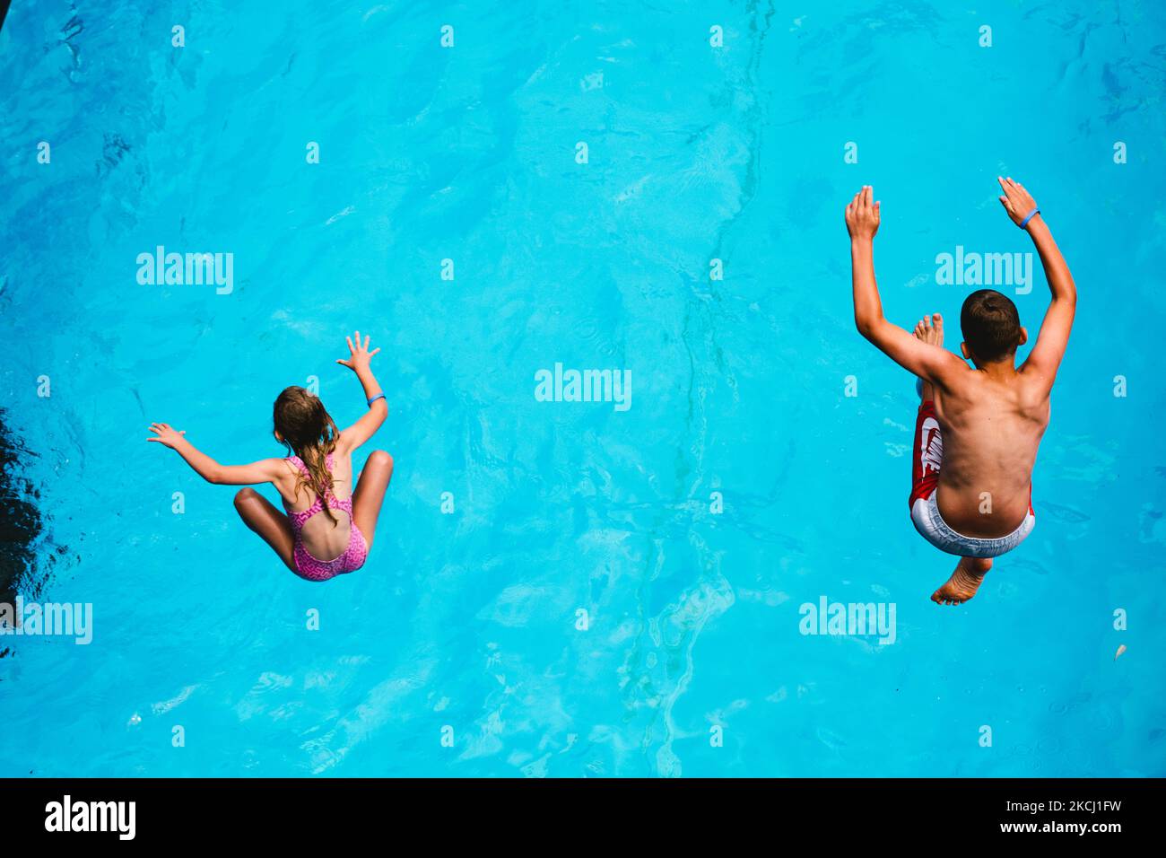 people participate the pool jumping contest at "Werksschwimmbad ...