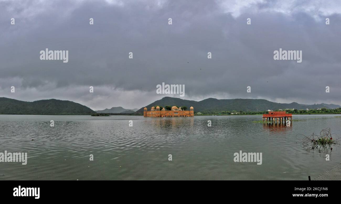 A view of 'Jal Mahal' as clouds hover over the city on a rainy day ...