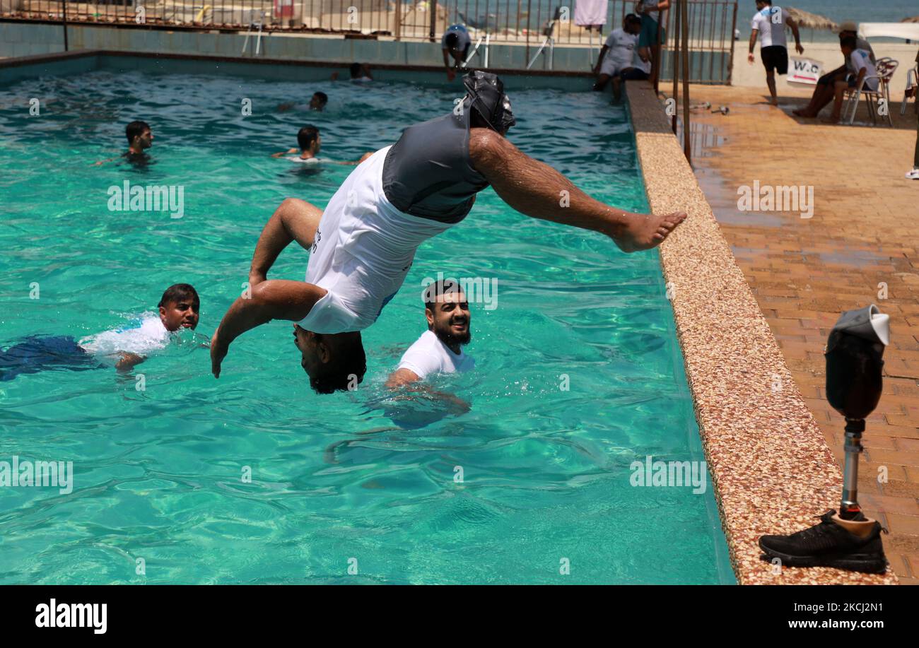 A young Palestinian amputee train to maintain physical activity in a ...