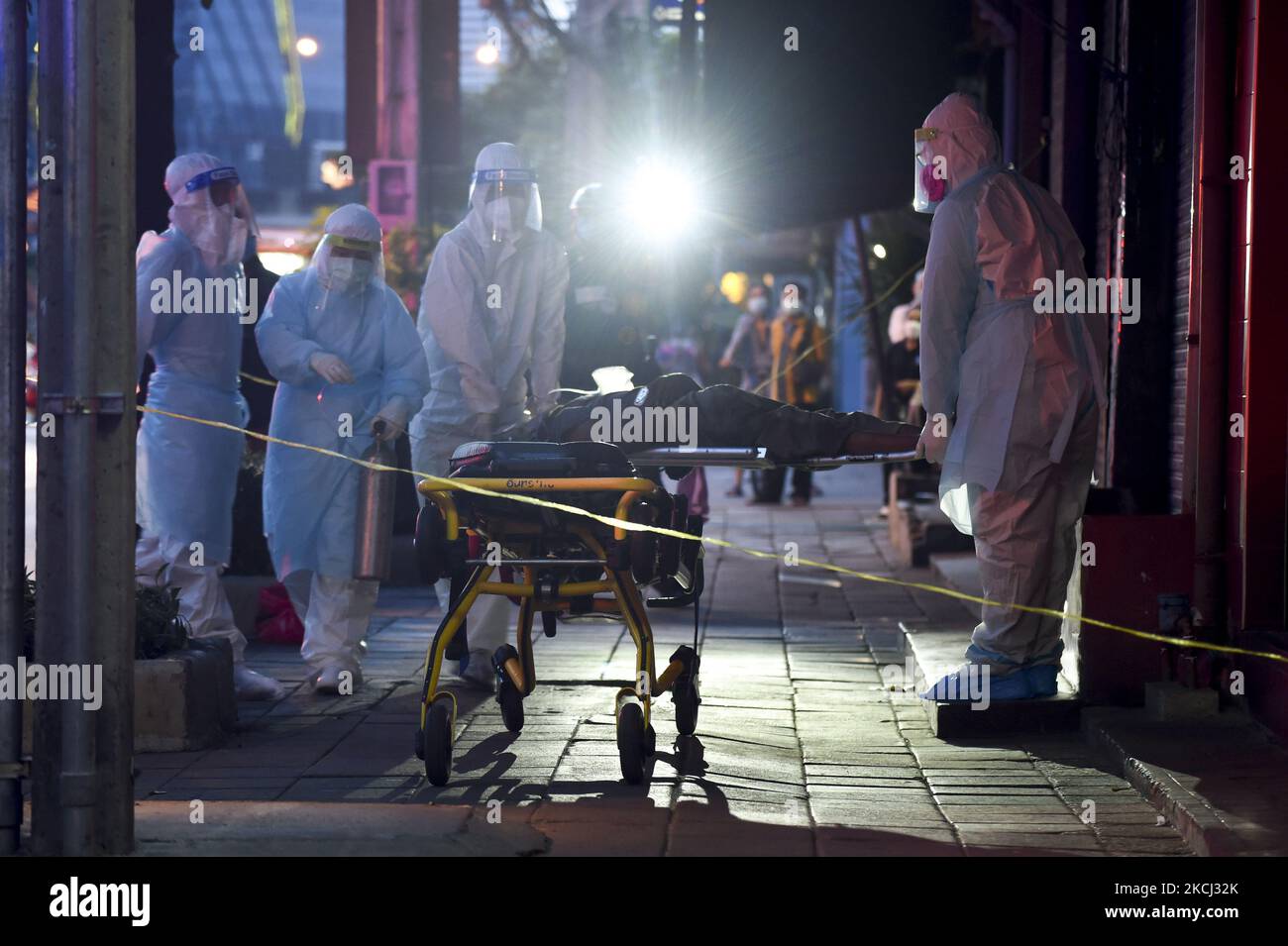 Rescue worker staff wearing personal protective equipment (PPE) gear to ...